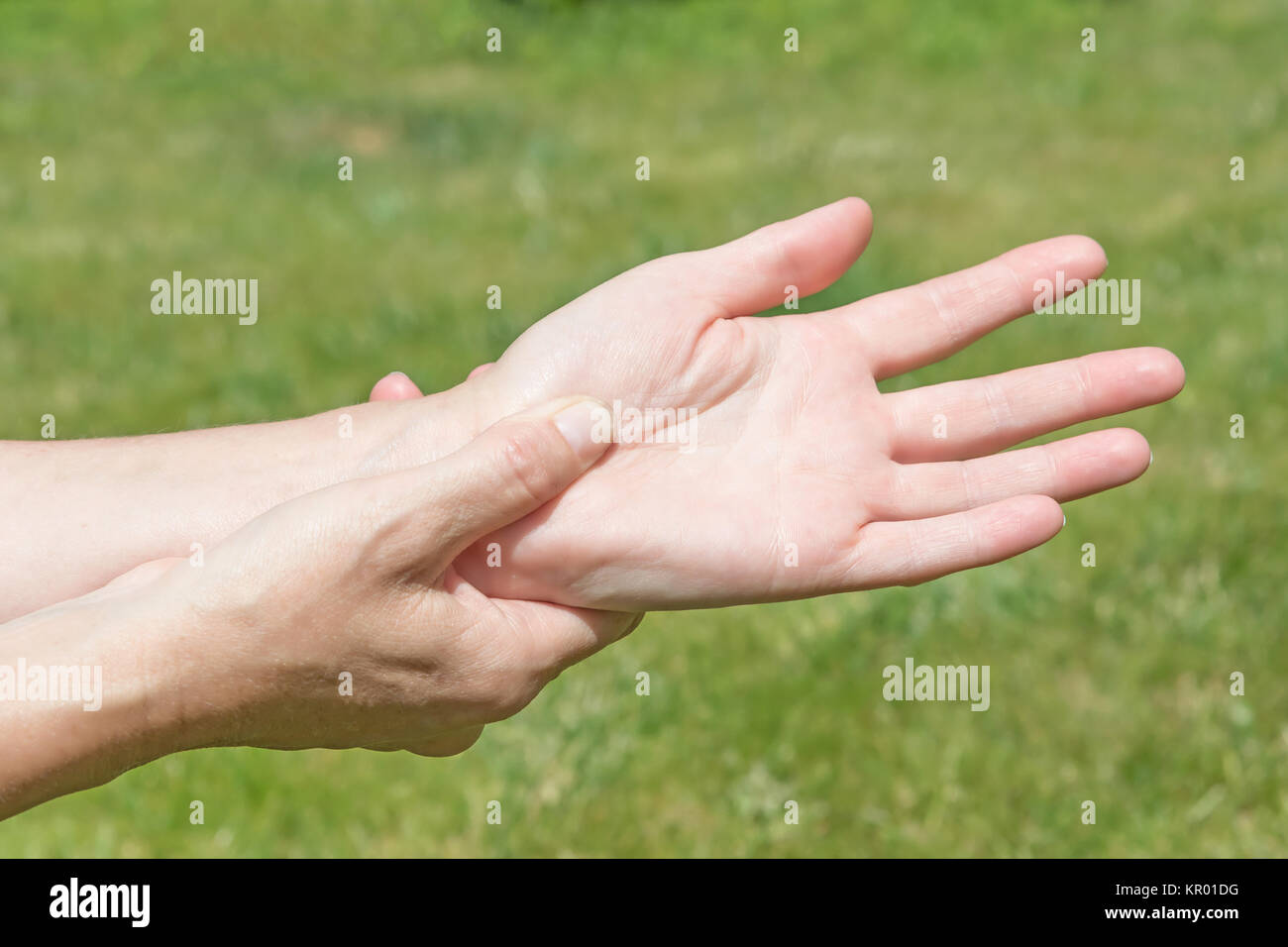 Woman showing hands pain Stock Photo - Alamy