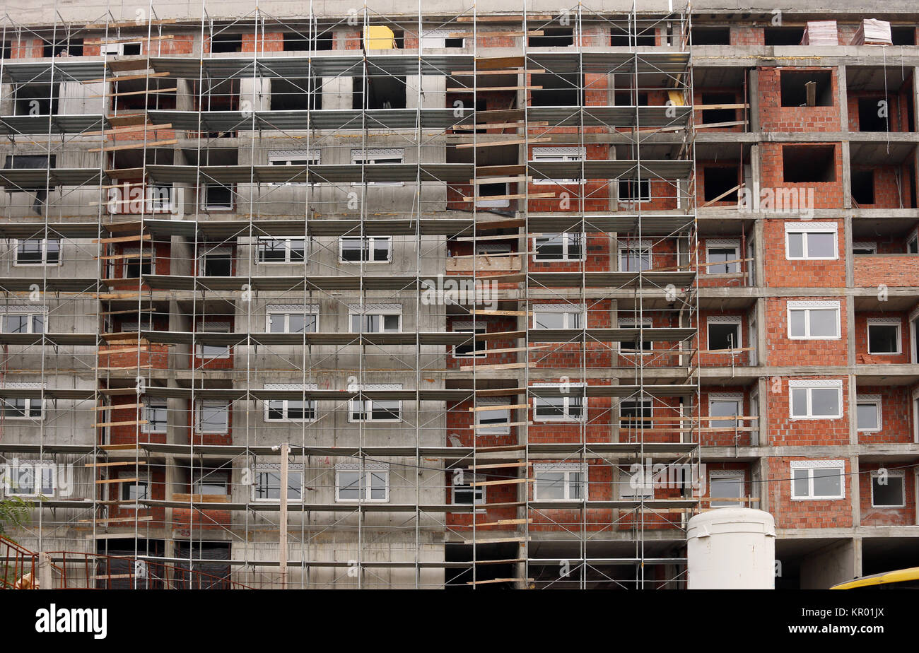 building construction site with scaffolding platforms Stock Photo - Alamy