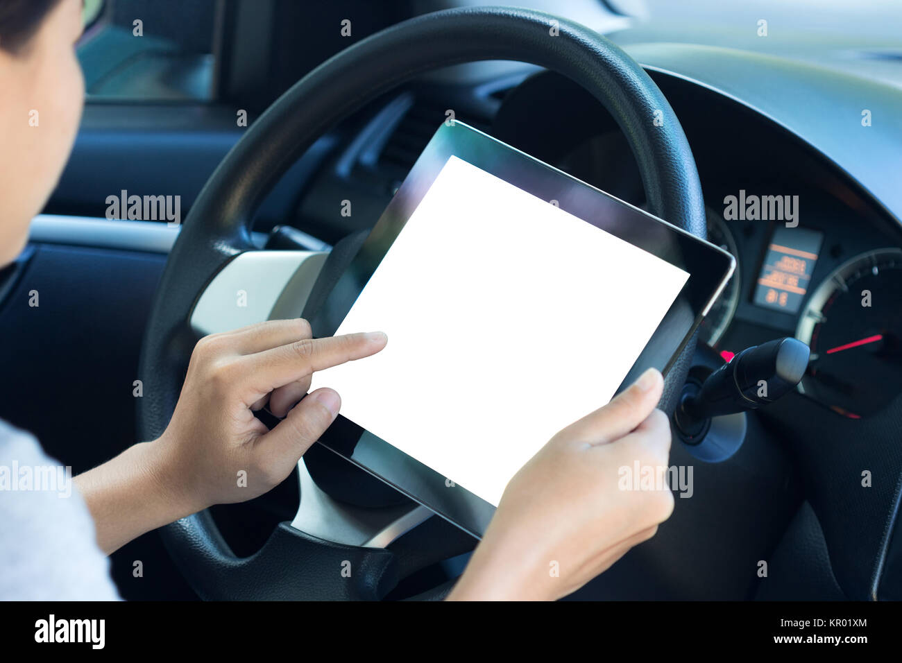 closeup women using tablet inside car Stock Photo - Alamy
