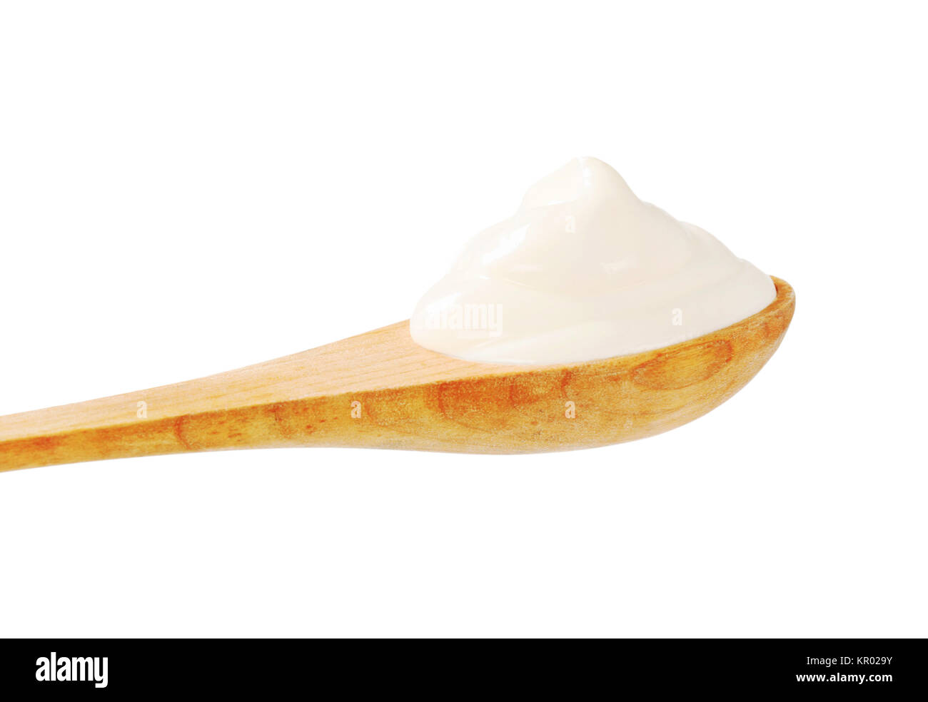 Spoon of plain yogurt white background Cut Out Stock Images & Pictures ...