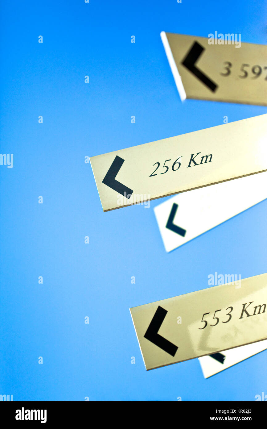 Distance signs on a square Stock Photo - Alamy