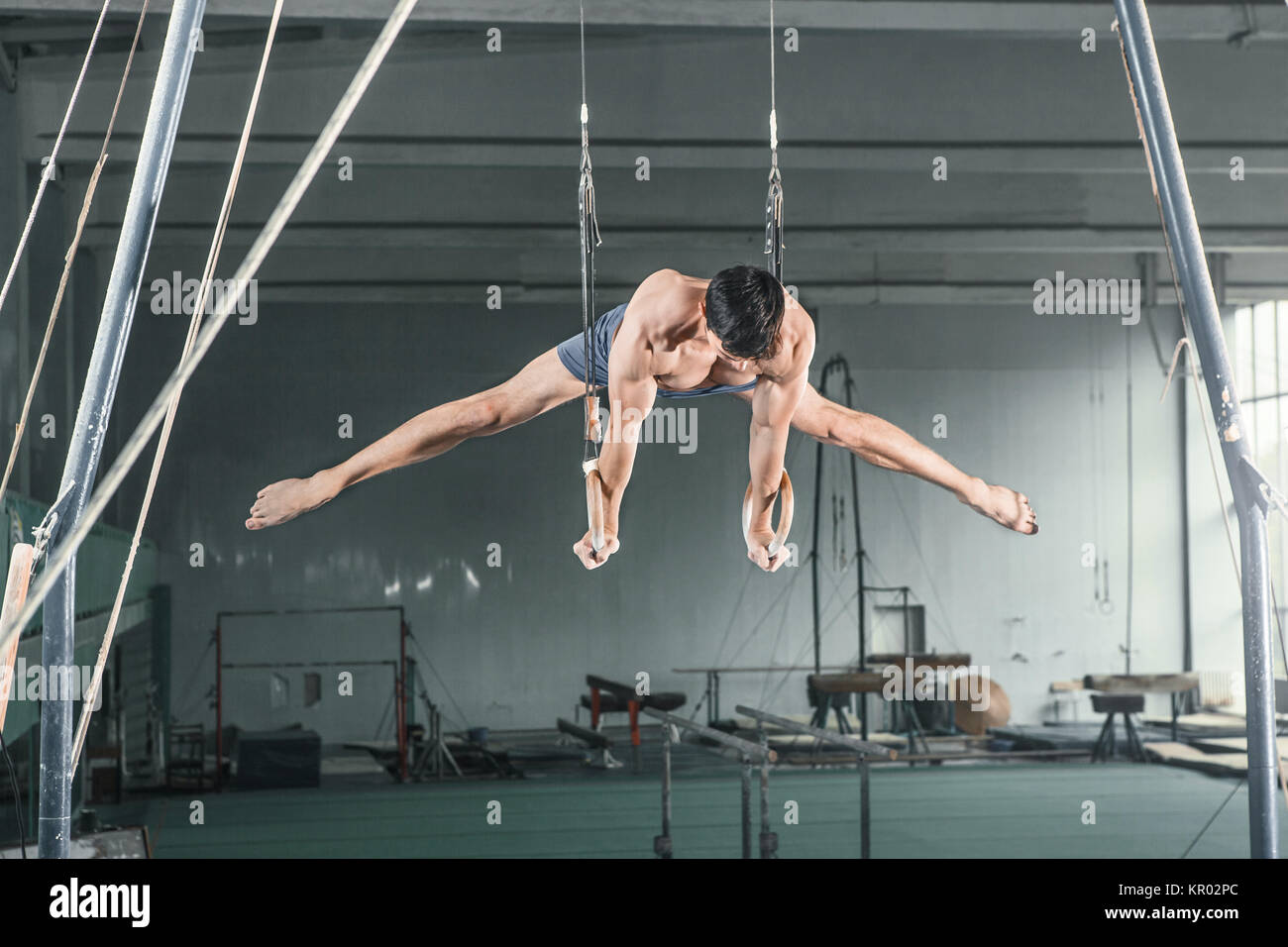 Gymnast on Stationary Rings Stock Photo - Alamy
