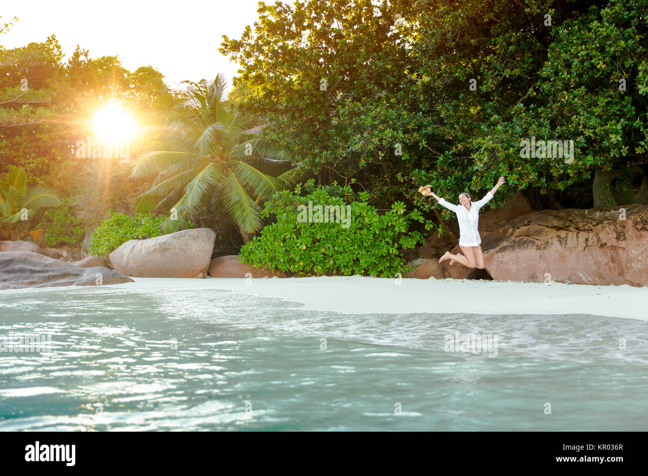 A beautiful woman walking on the beach Stock Photo - Alamy