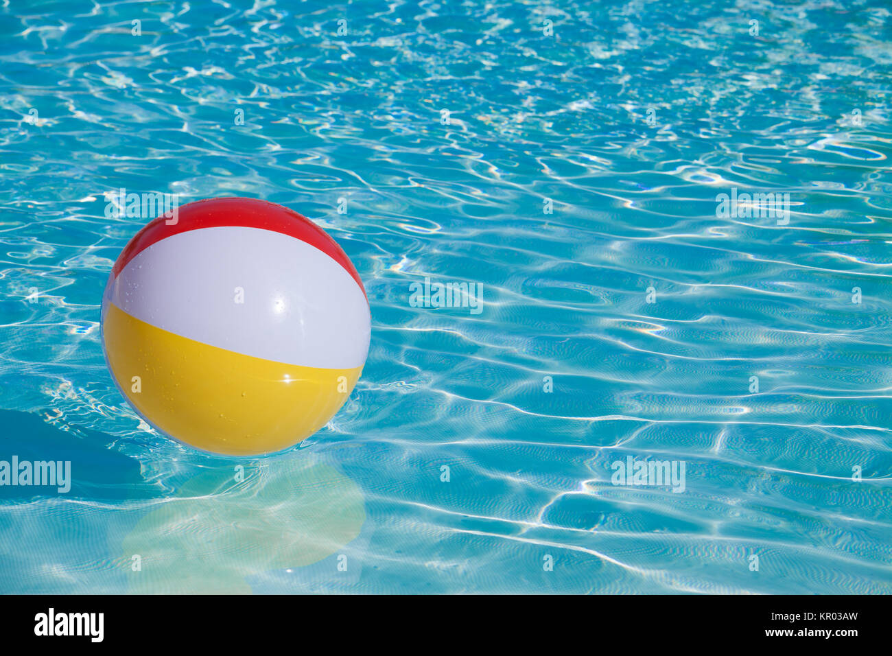Inflatable colorful ball floating in a swimming pool Stock Photo - Alamy