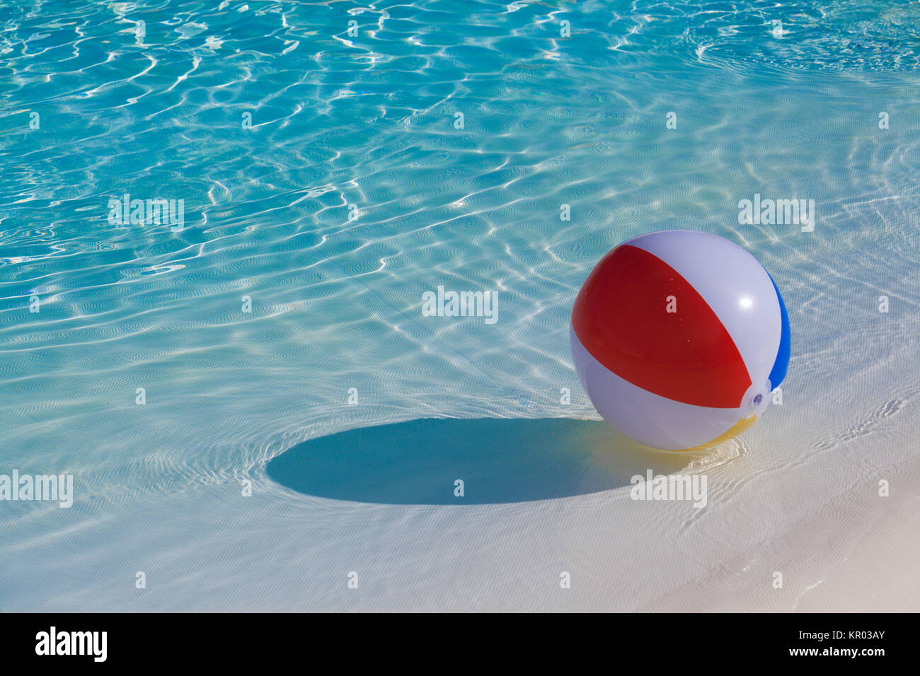 Inflatable colorful ball floating in a swimming pool Stock Photo - Alamy
