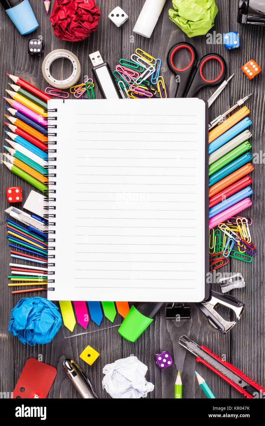 Various office supplies on desk Stock Photo - Alamy