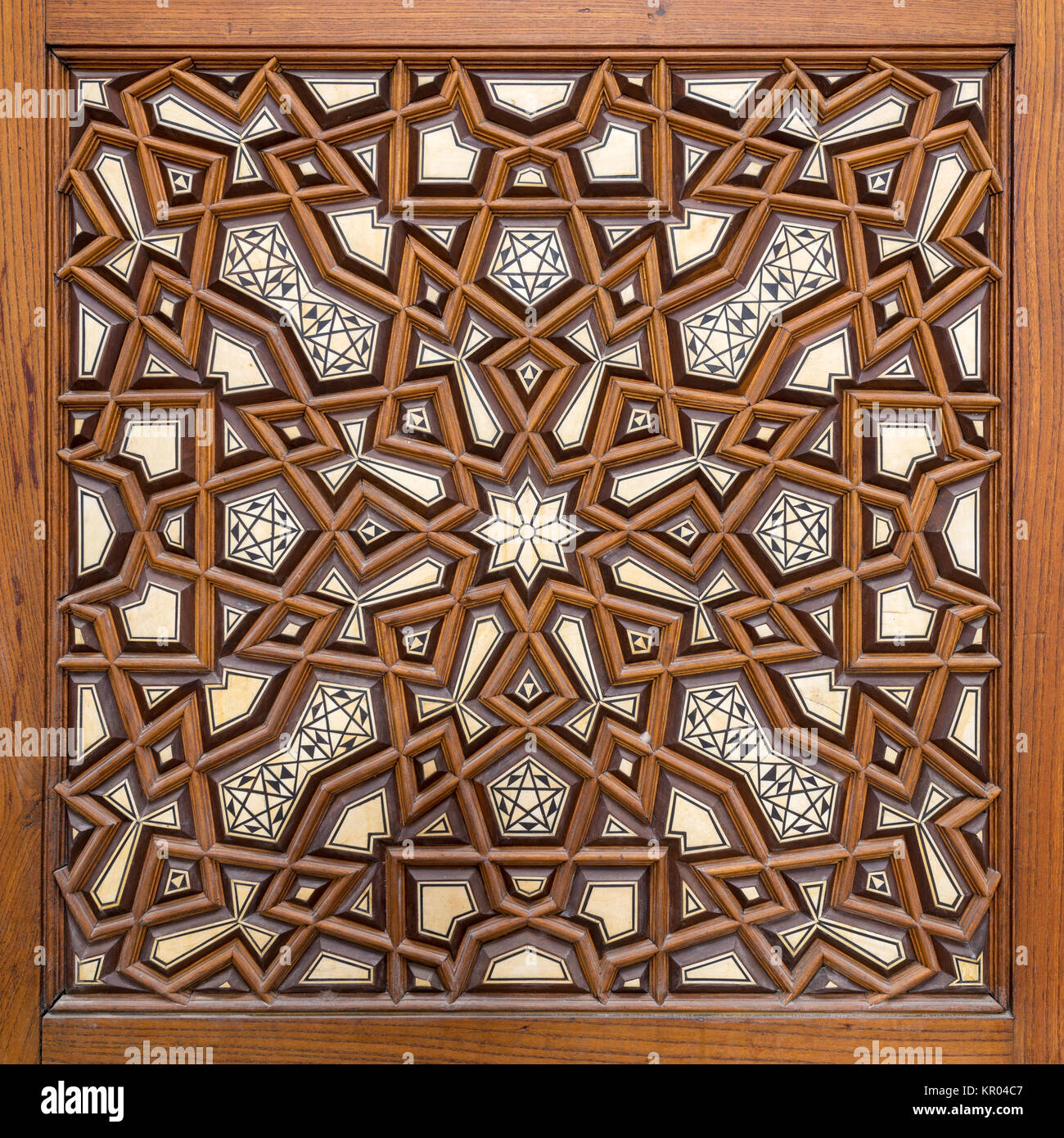 Closeup of arabesque ornaments of an old aged decorated wooden door ...