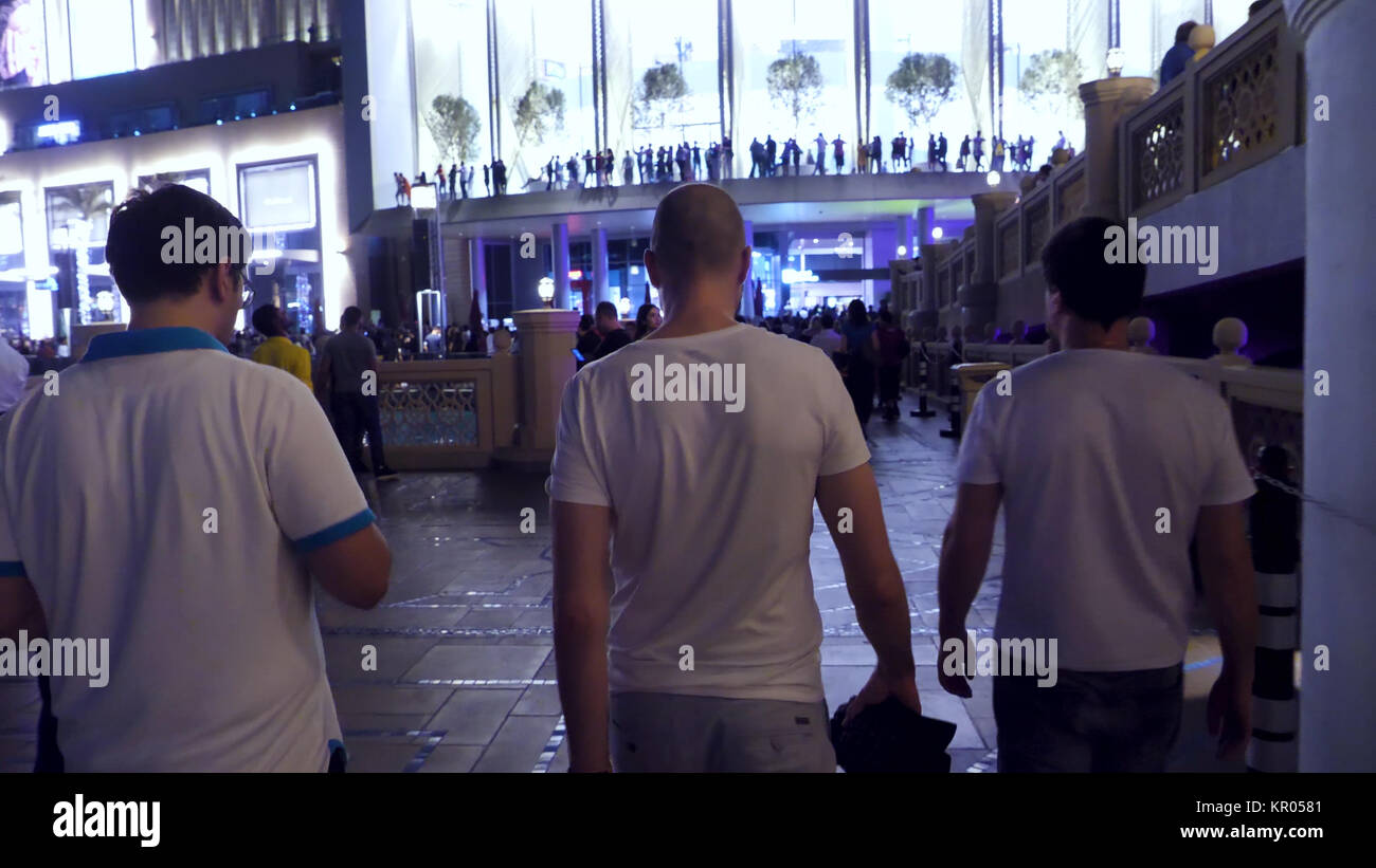 America, New YorkRear - 18 MAY, 2017: Rear view of three men walk in ...