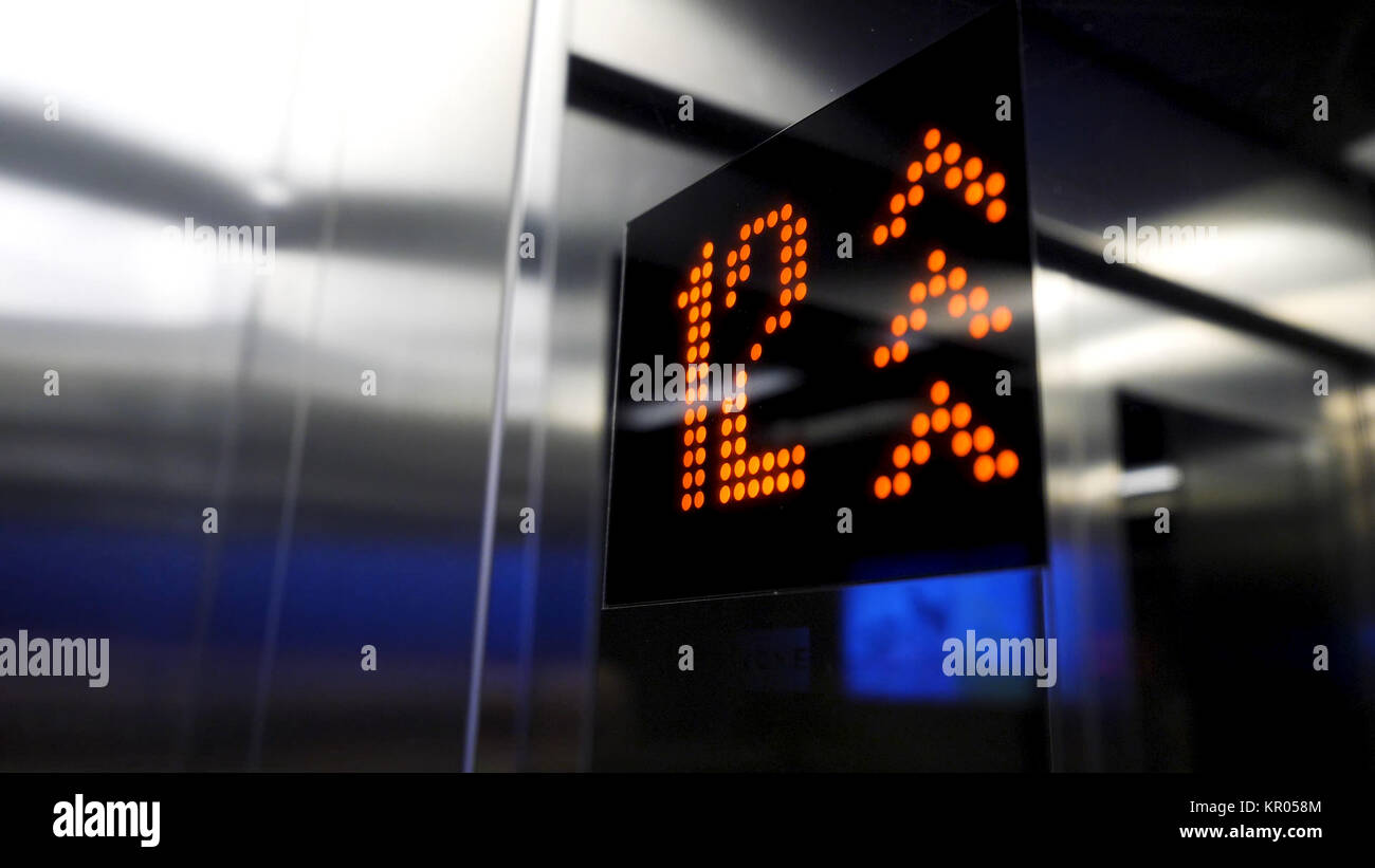 In elevator of modern business center on electronic LCD display ...