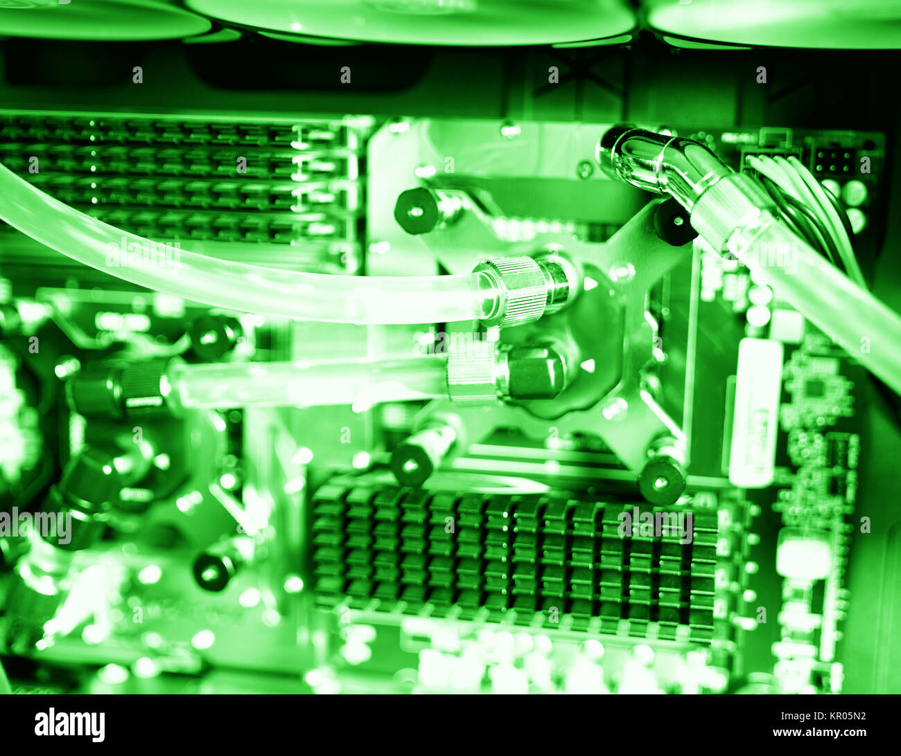 Inside green water cooled computer bokeh background Stock Photo - Alamy