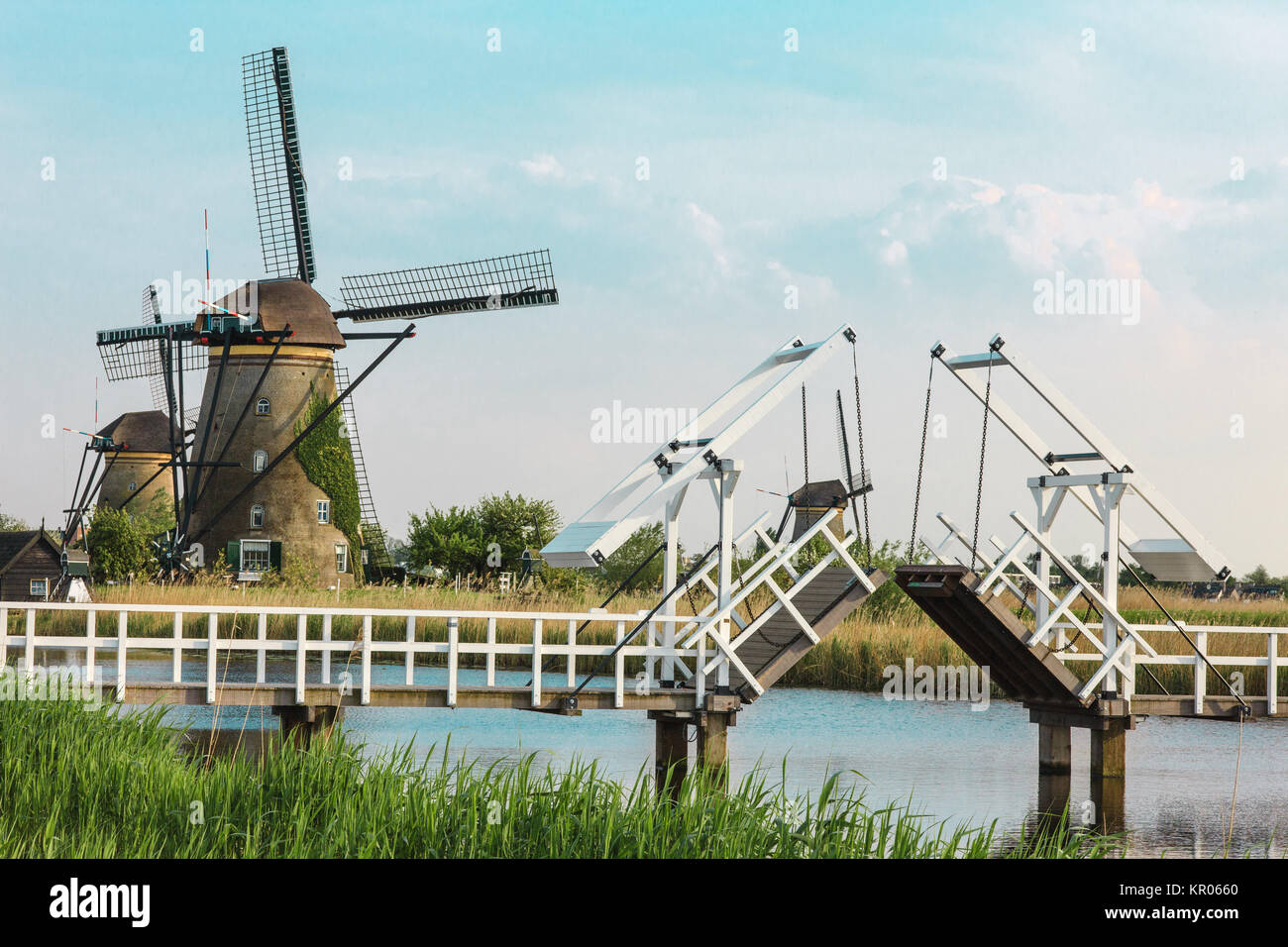 beautiful traditional dutch windmills near the water channels with ...