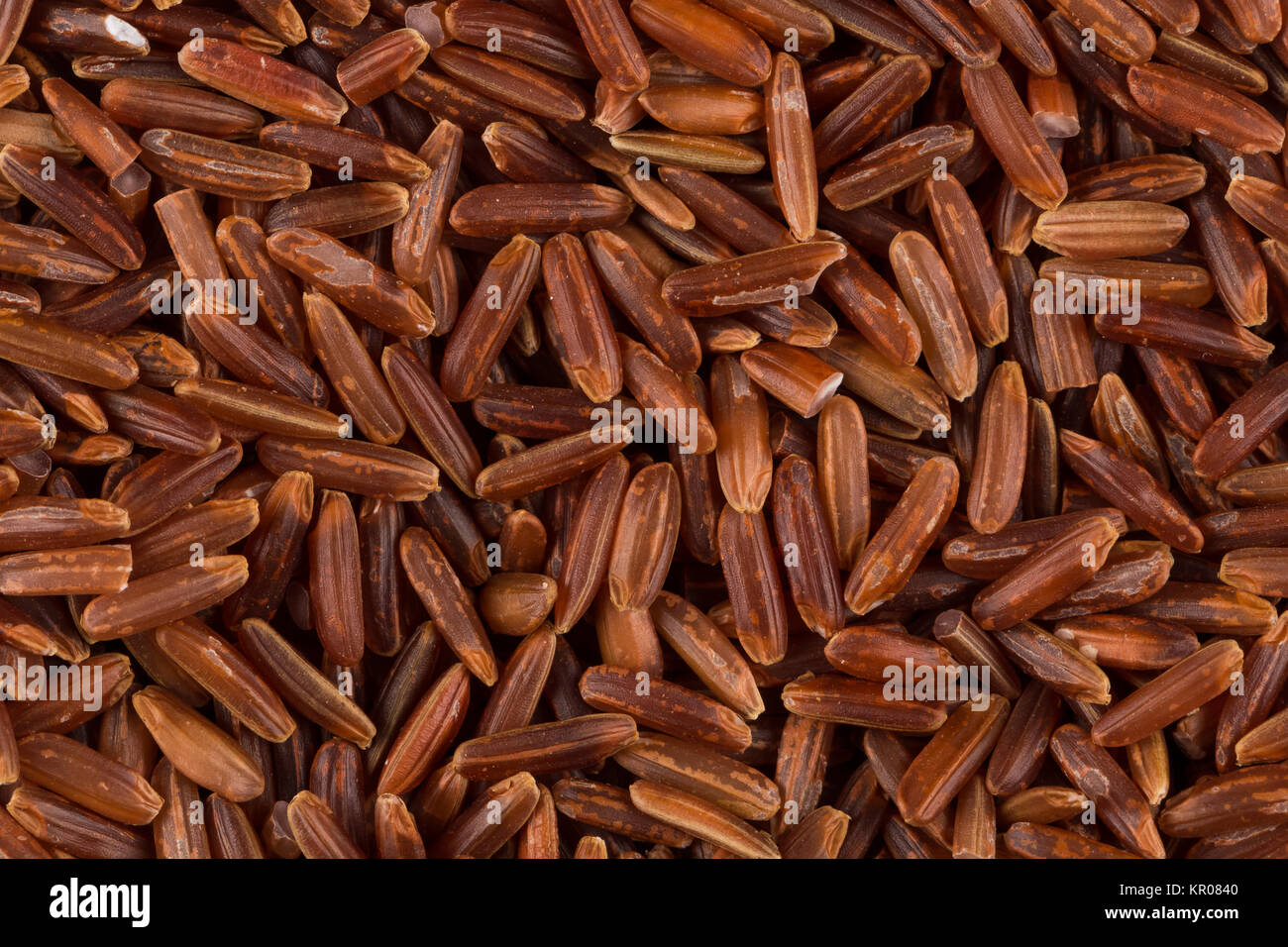 Raw red rice Stock Photo - Alamy