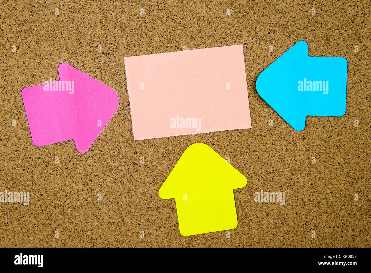 Blank paper notes in shape of arrows over cork board Stock Photo - Alamy