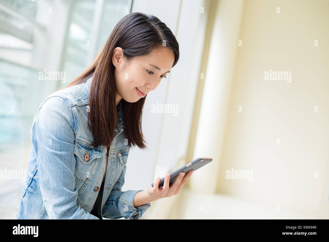 Asian woman use of mobile phone Stock Photo - Alamy