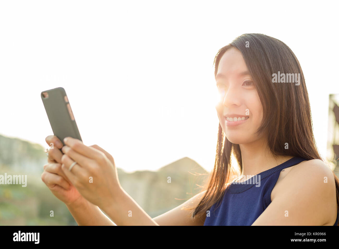 Woman use of mobile phone Stock Photo - Alamy
