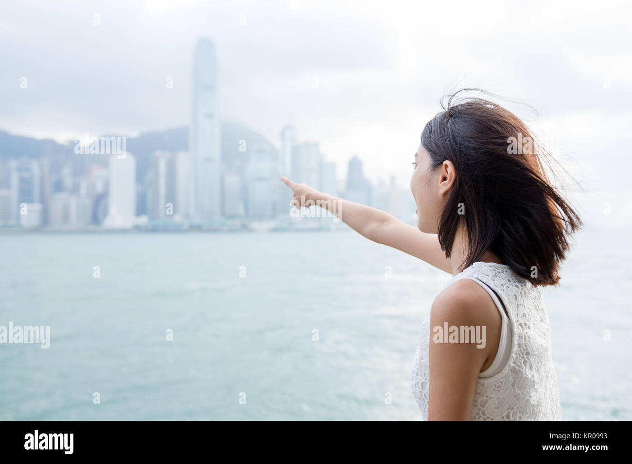 Back view of girl looking out to sea hi-res stock photography and ...