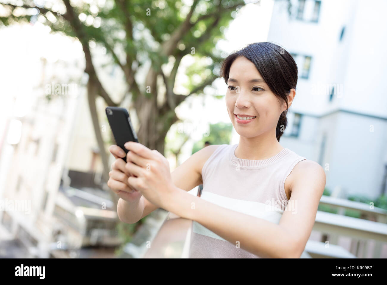Woman use of mobile phone Stock Photo - Alamy