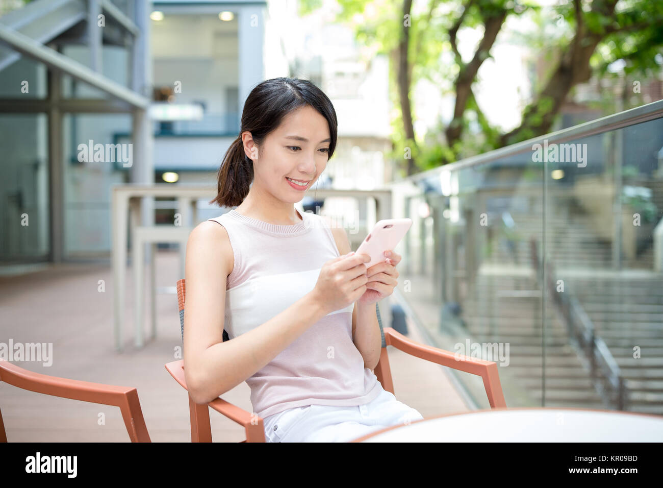 Woman use of mobile phone Stock Photo - Alamy