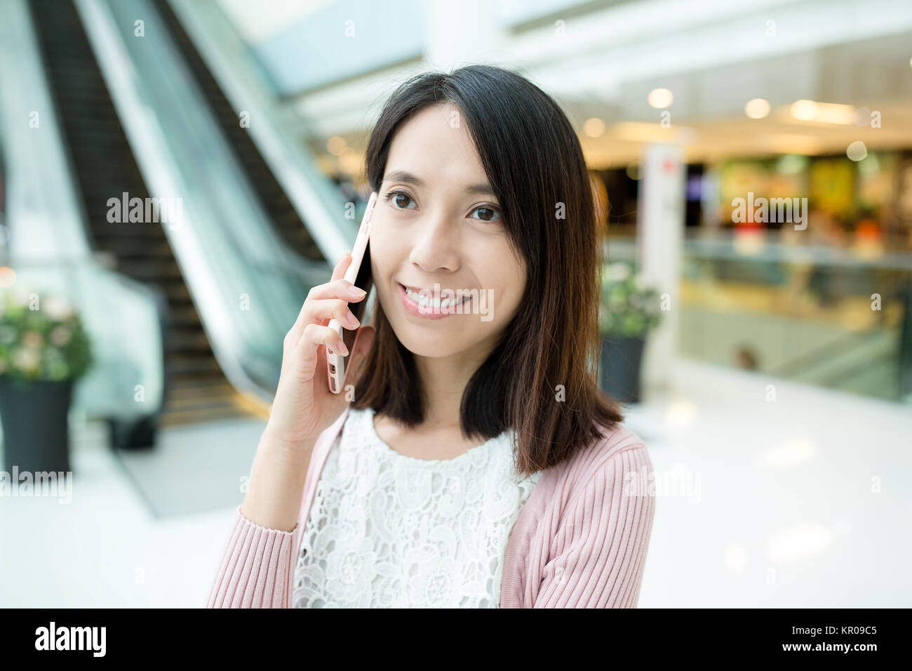 Asian woman chat on cellphone Stock Photo - Alamy