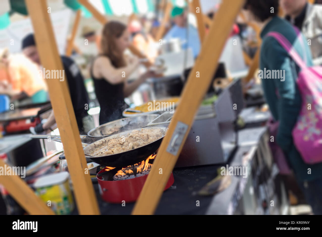 Cheff cooking on outdoor street food festival Stock Photo - Alamy