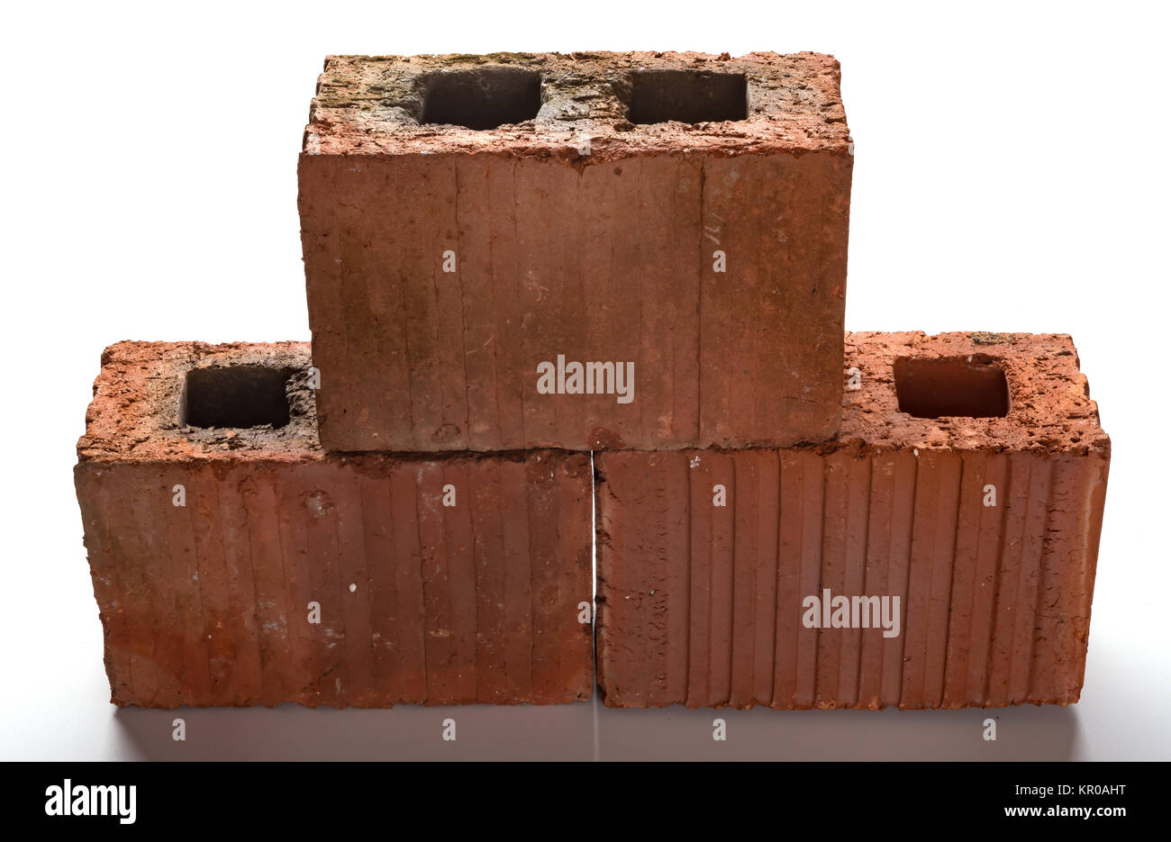 three bricks on a white background Stock Photo - Alamy