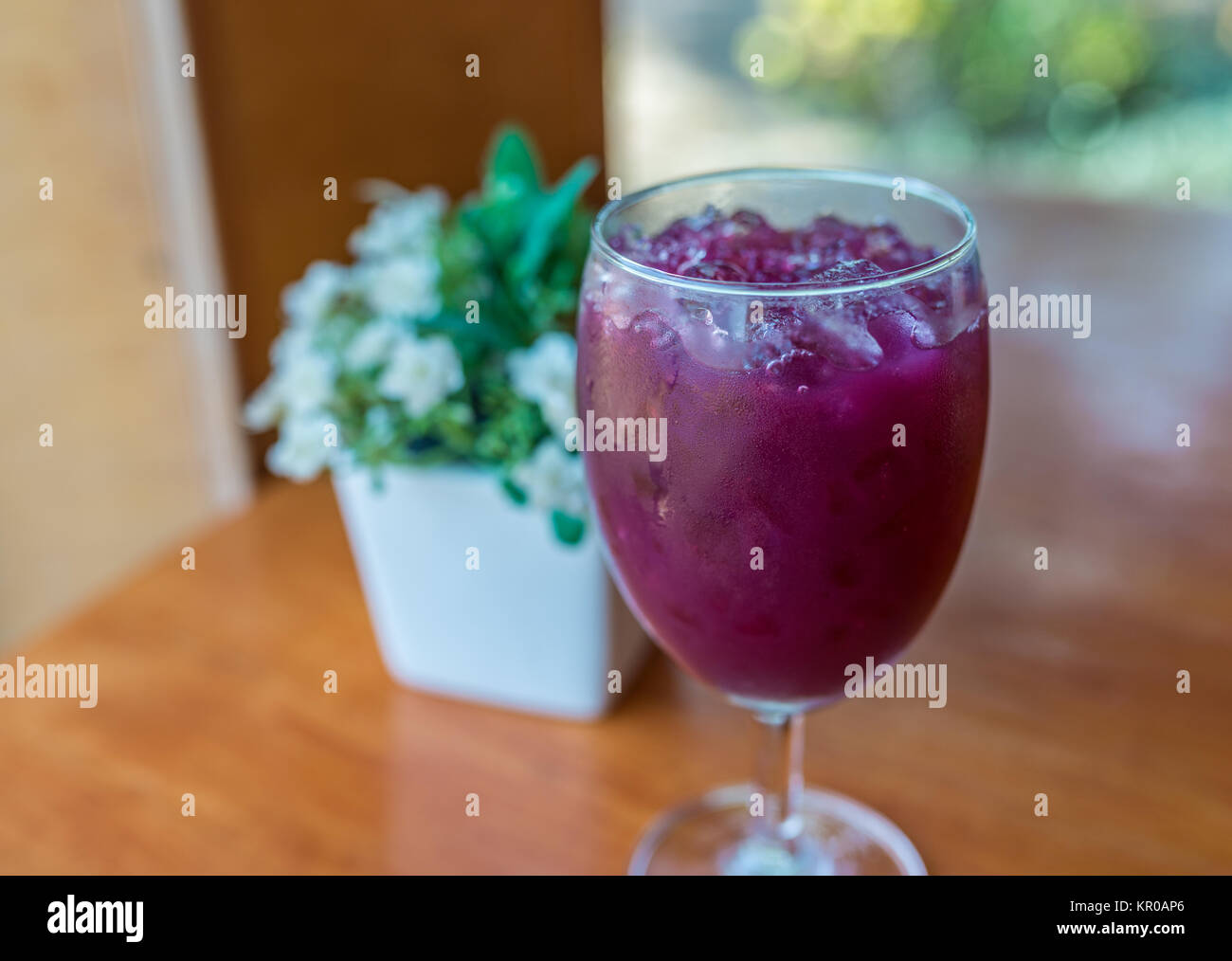 Glass of grape juice with ice Stock Photo - Alamy