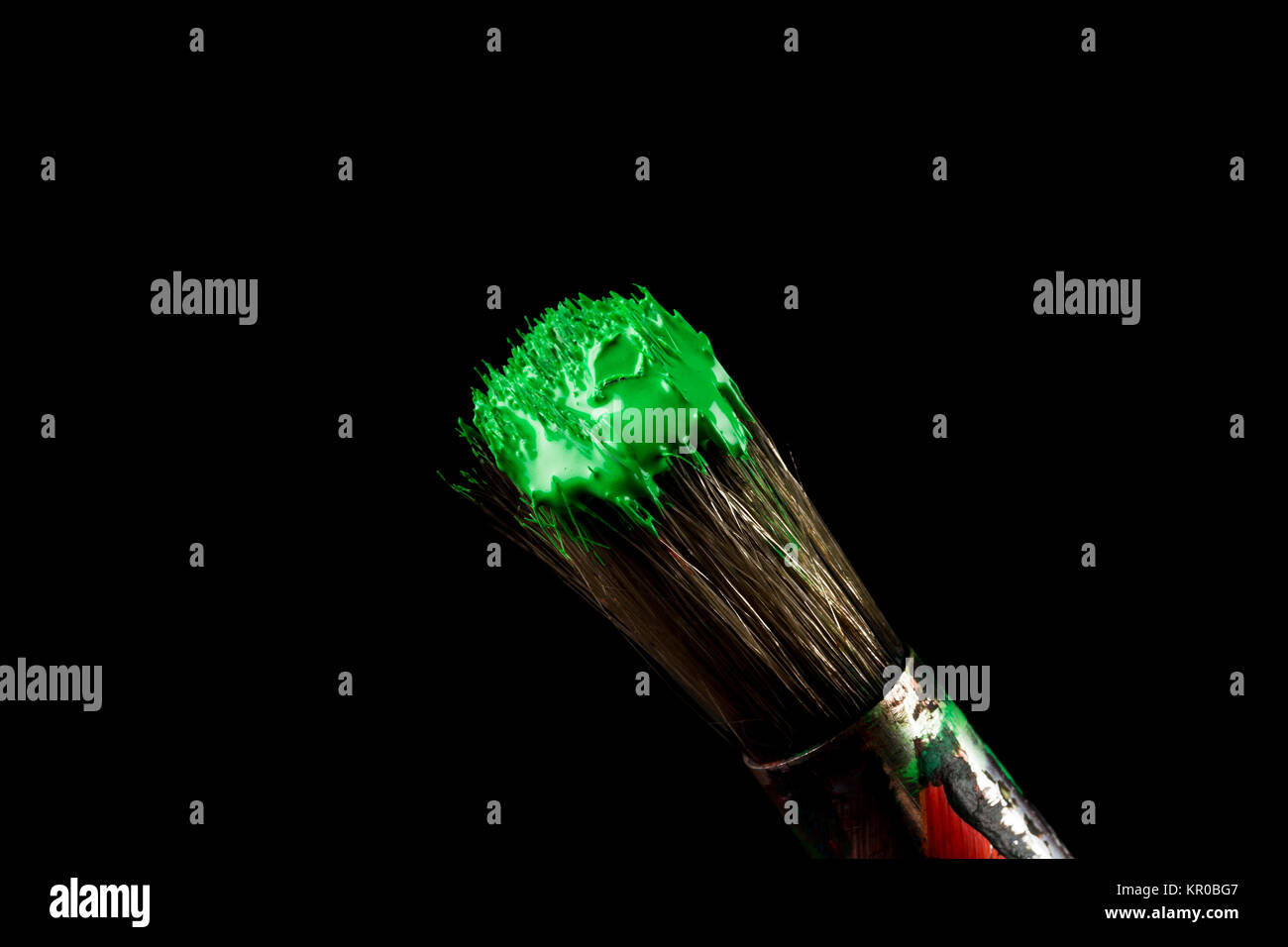 paint brush painting with green color Stock Photo - Alamy