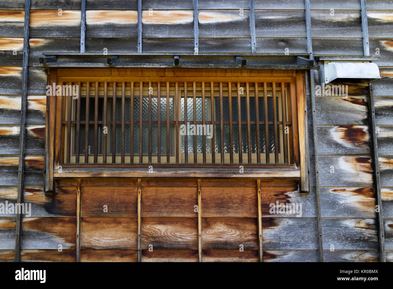 Kanazawa - Japan, June 11, 2017: Window with bars in a wooden two-story ...