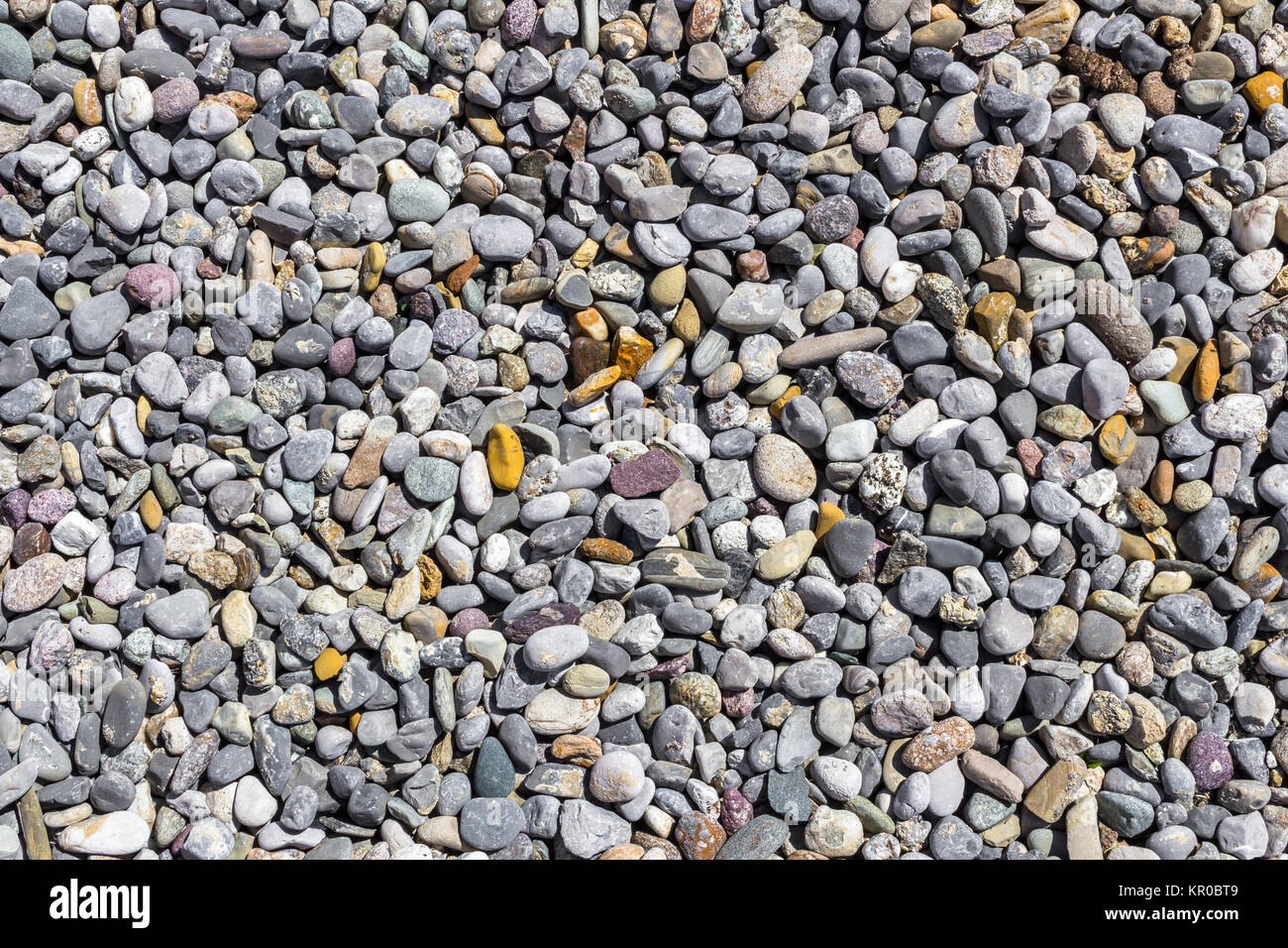 Small pebbles background Stock Photo - Alamy