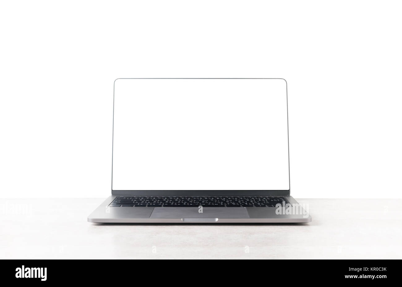 Front view of the laptop is on the work table isolated on white ...