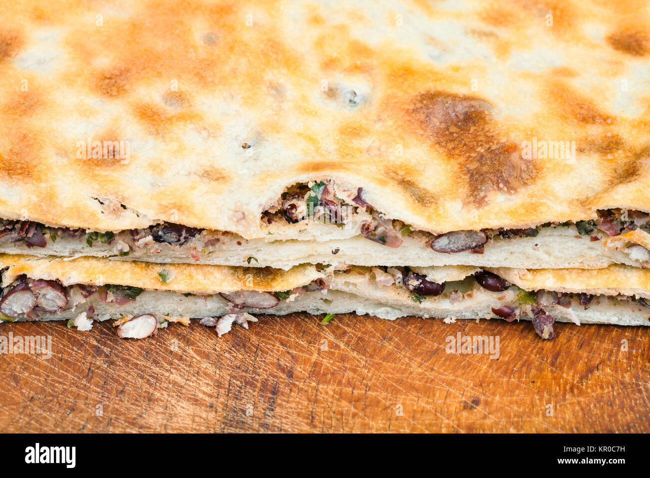 cutting bean filled bread (Lobiani) close up Stock Photo - Alamy