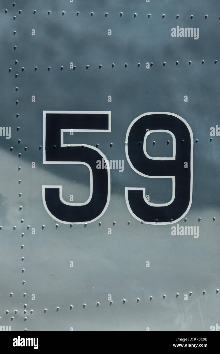 Figure 59 applied to a metal surface with rivets Stock Photo - Alamy