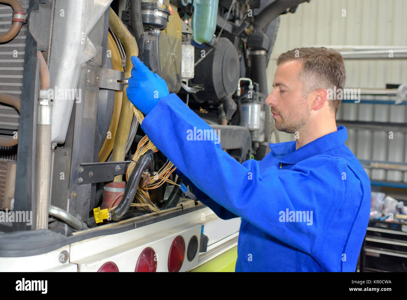 fixing heavy vehicle's engine Stock Photo - Alamy