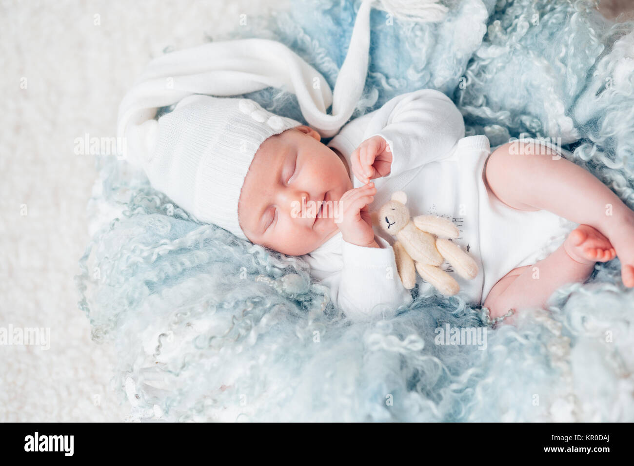 sleeping newborn baby on wool blanket Stock Photo - Alamy