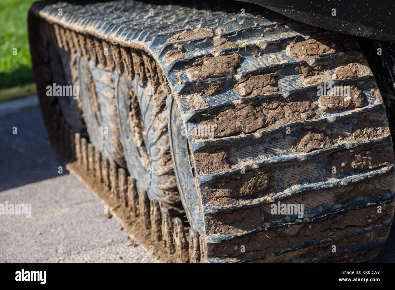 Muddy caterpillar track Stock Photo - Alamy