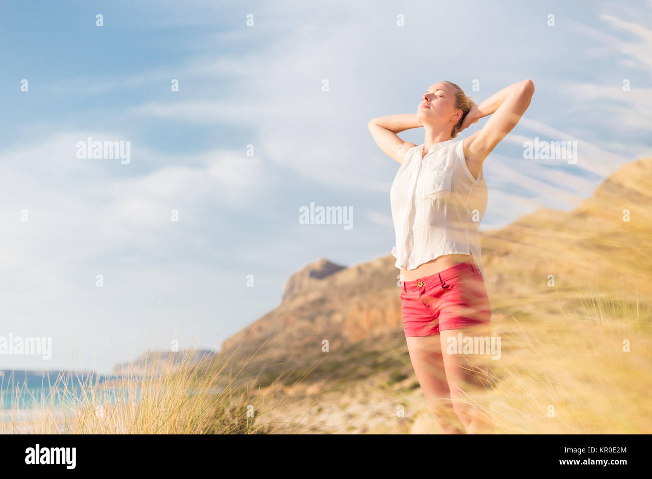 Free Happy Woman Enjoying Sun on Vacations Stock Photo - Alamy