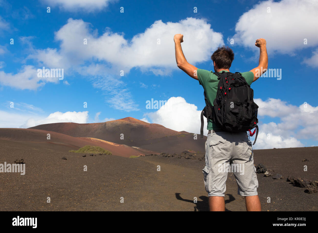 Man reaching the top of mountain Stock Photo - Alamy
