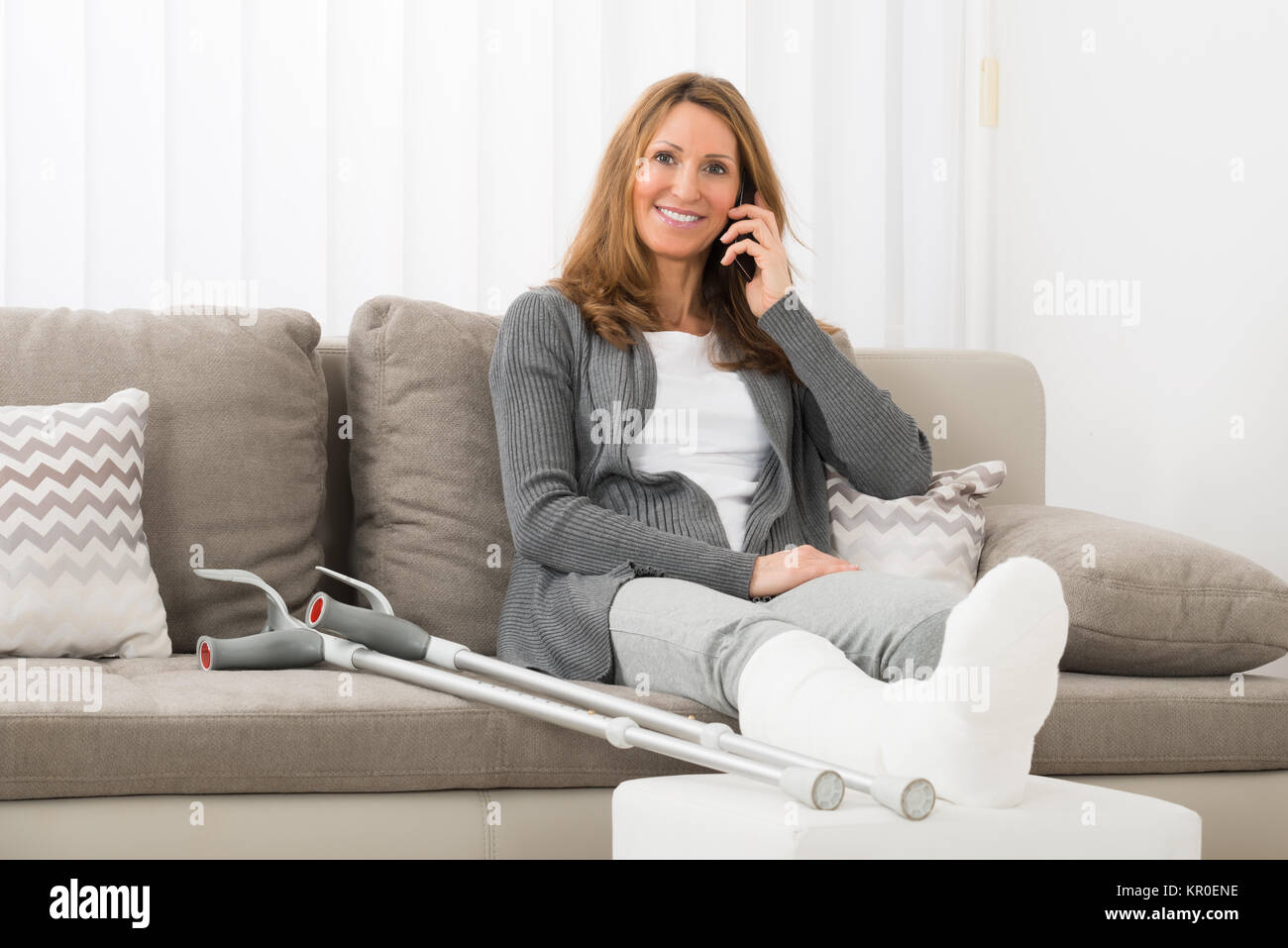 Woman plaster cast on leg hi-res stock photography and images - Alamy