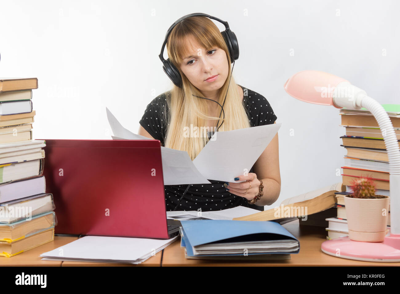 Student thought comparing electronic and paper documents Stock Photo ...