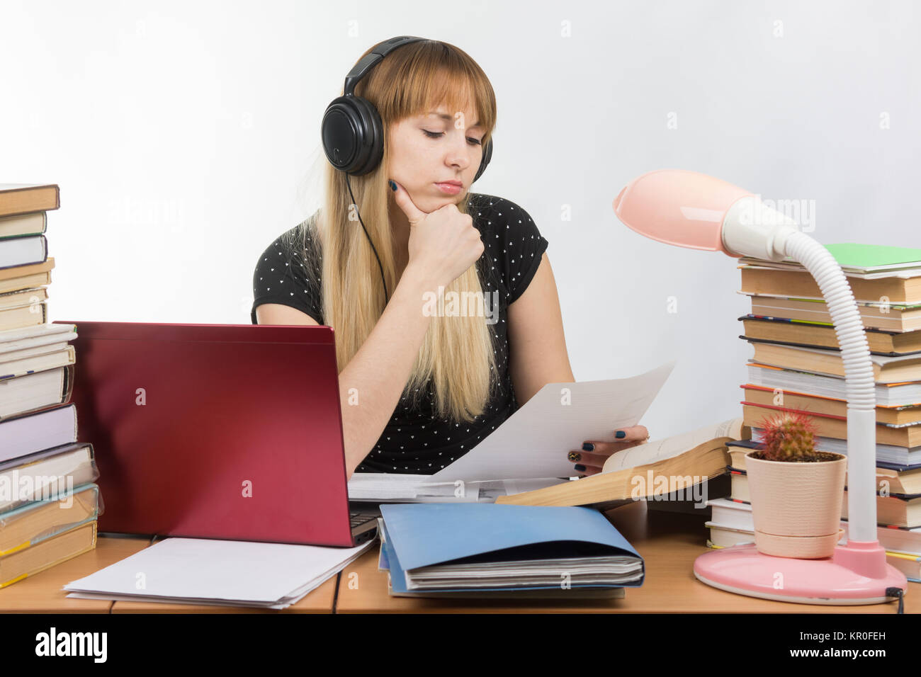 Student thought reading the paper document Stock Photo - Alamy