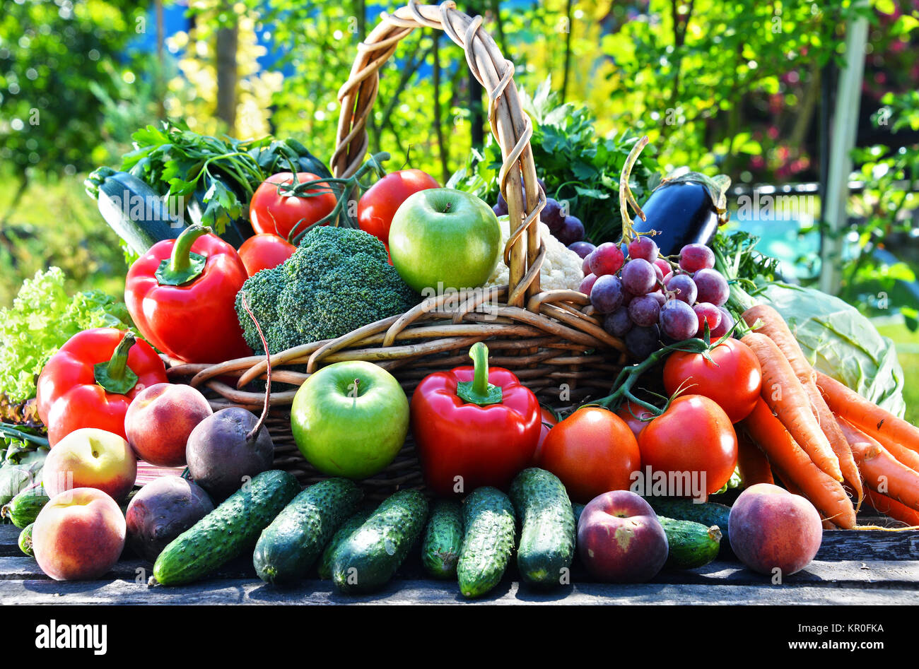 Variety of fresh organic vegetables and fruits in the garden Stock ...