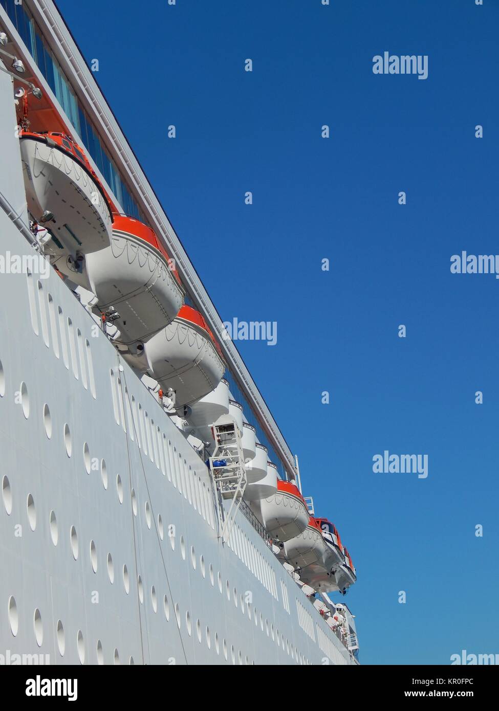 side view (port) of a big white cruise ship with lifeboats Stock Photo ...