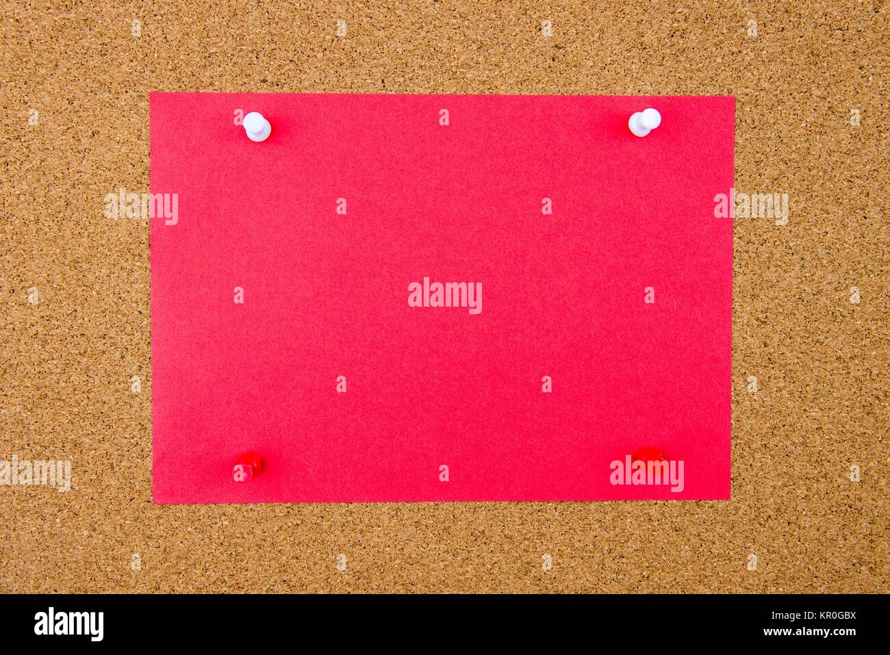 Blank red paper note pinned on cork board Stock Photo - Alamy