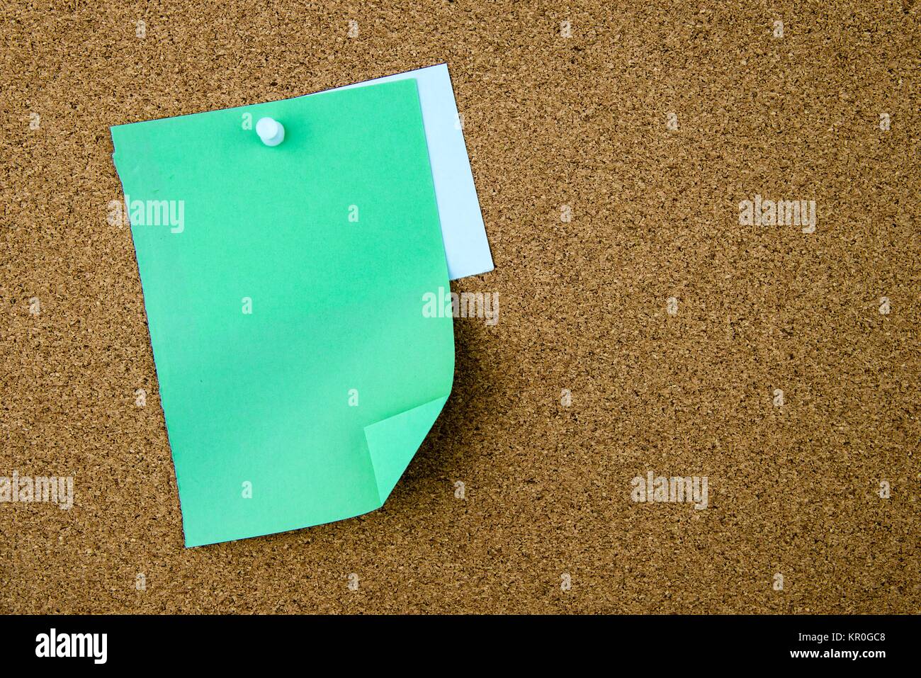 Blank turquoise paper note pinned on cork board Stock Photo - Alamy