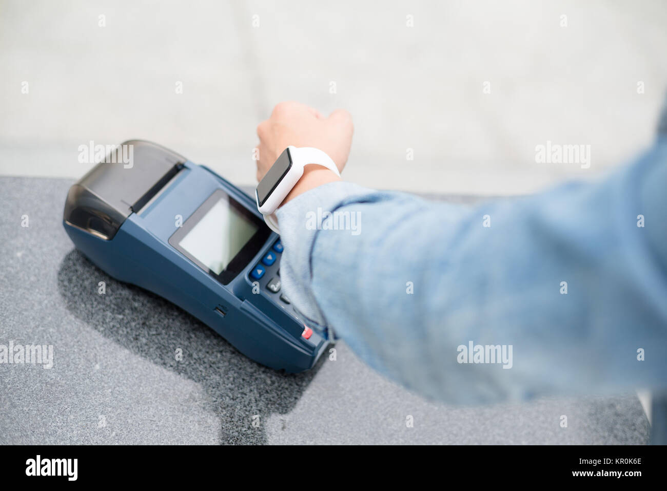 Woman pay with smart watch Stock Photo - Alamy