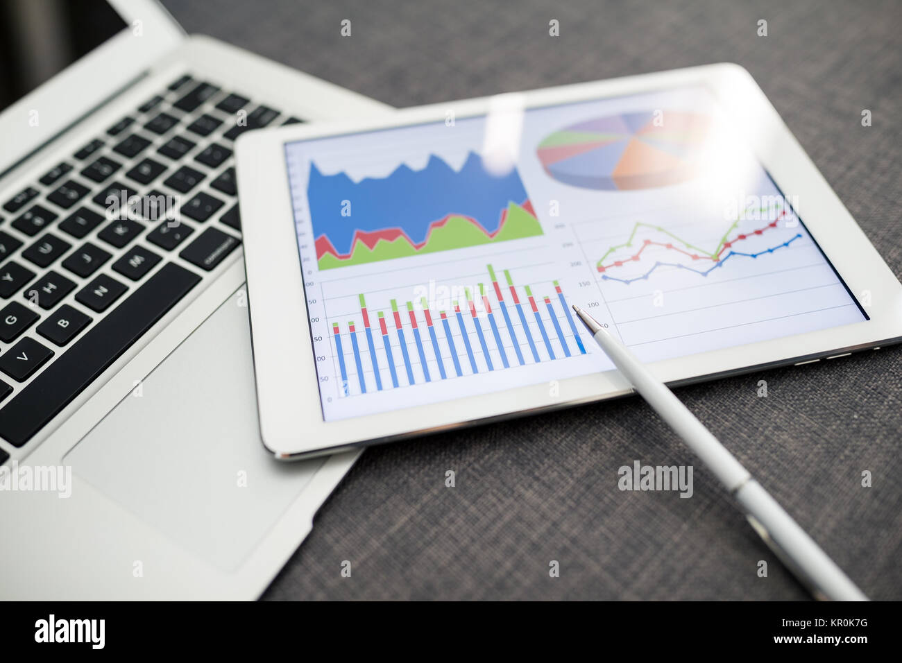 Digital tablet showing charts and diagram Stock Photo - Alamy