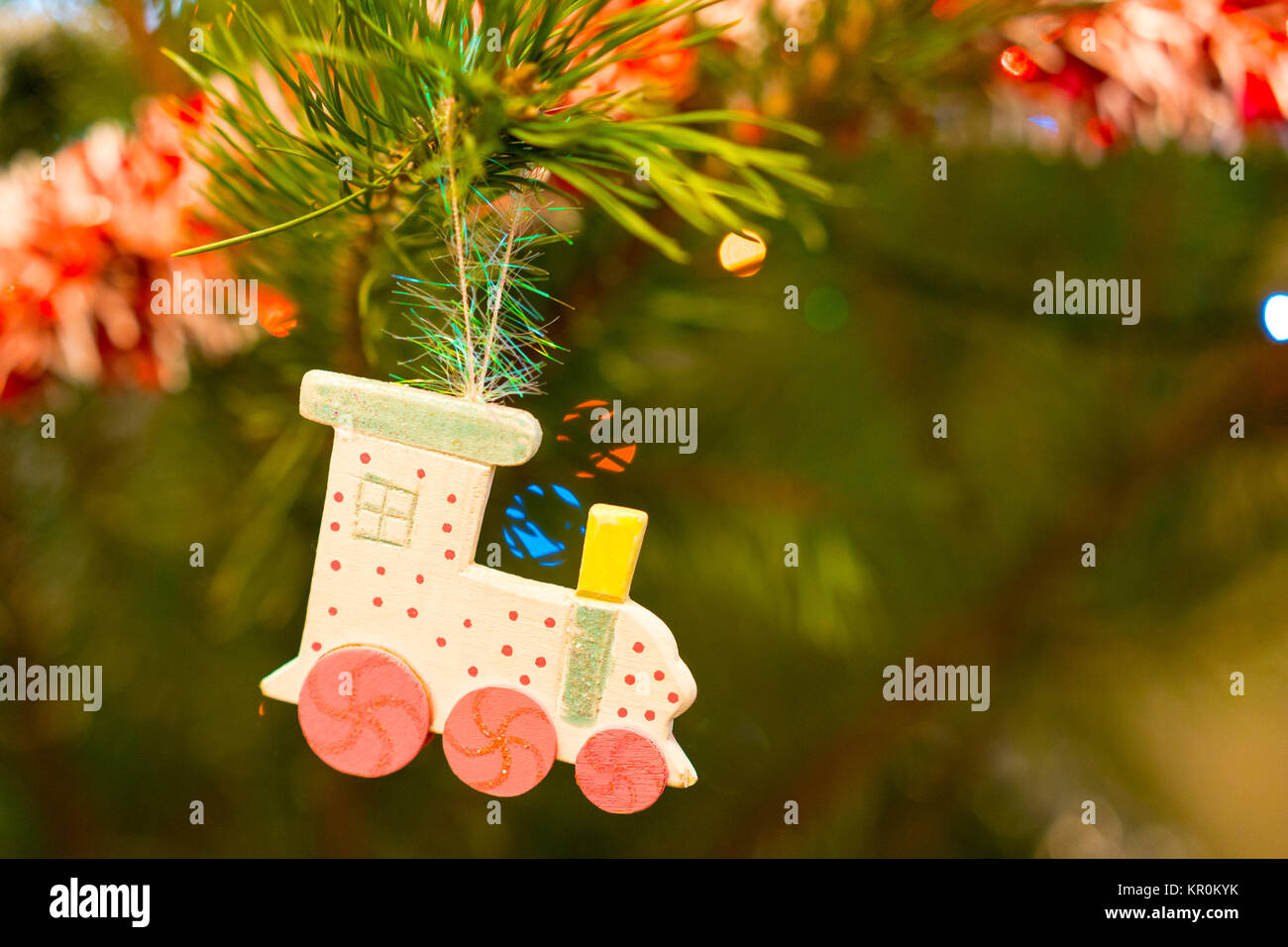 Toy Train on a Christmas Tree Stock Photo - Alamy