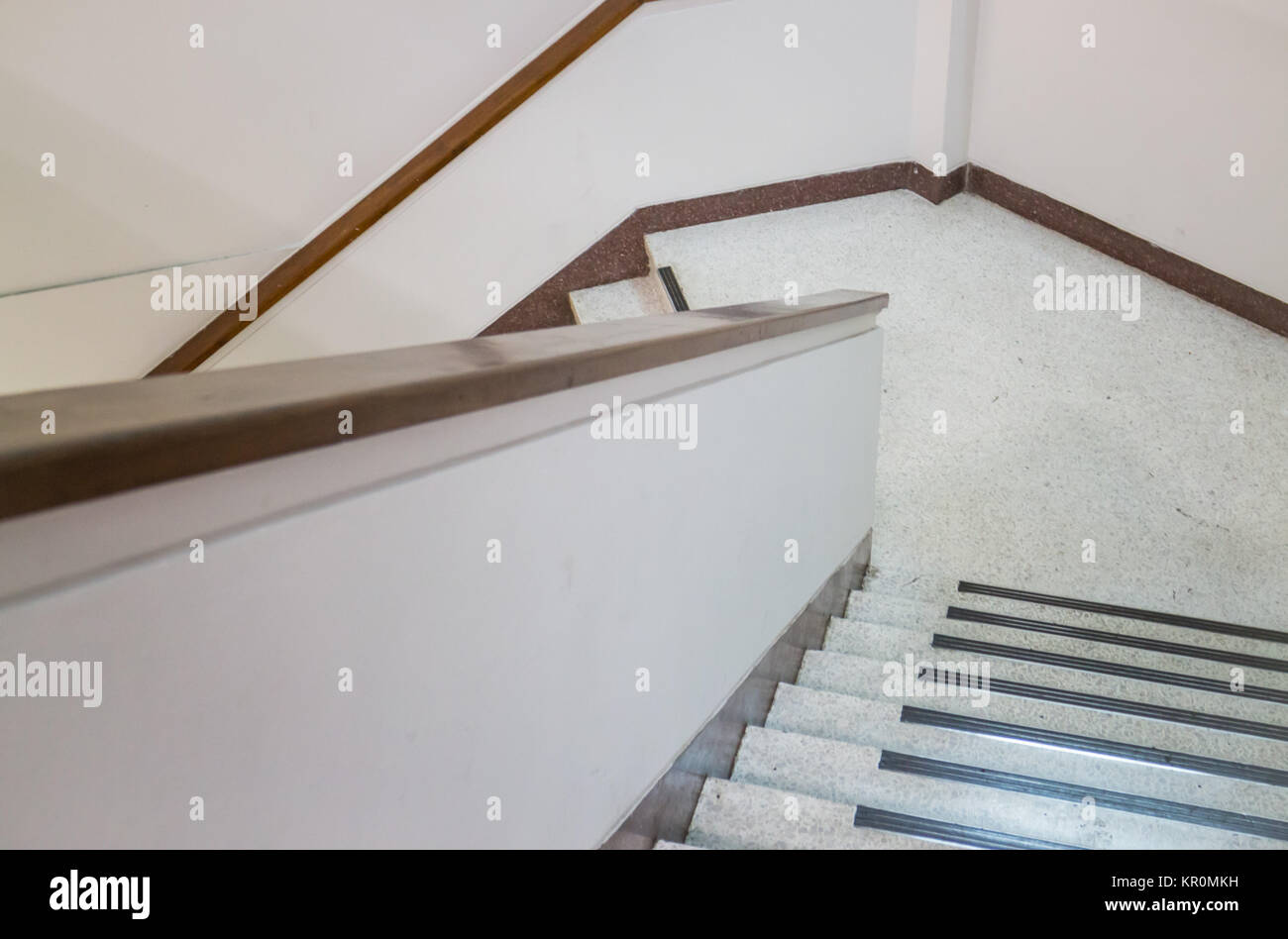 Empty office staircase vanishing downstairs Stock Photo - Alamy