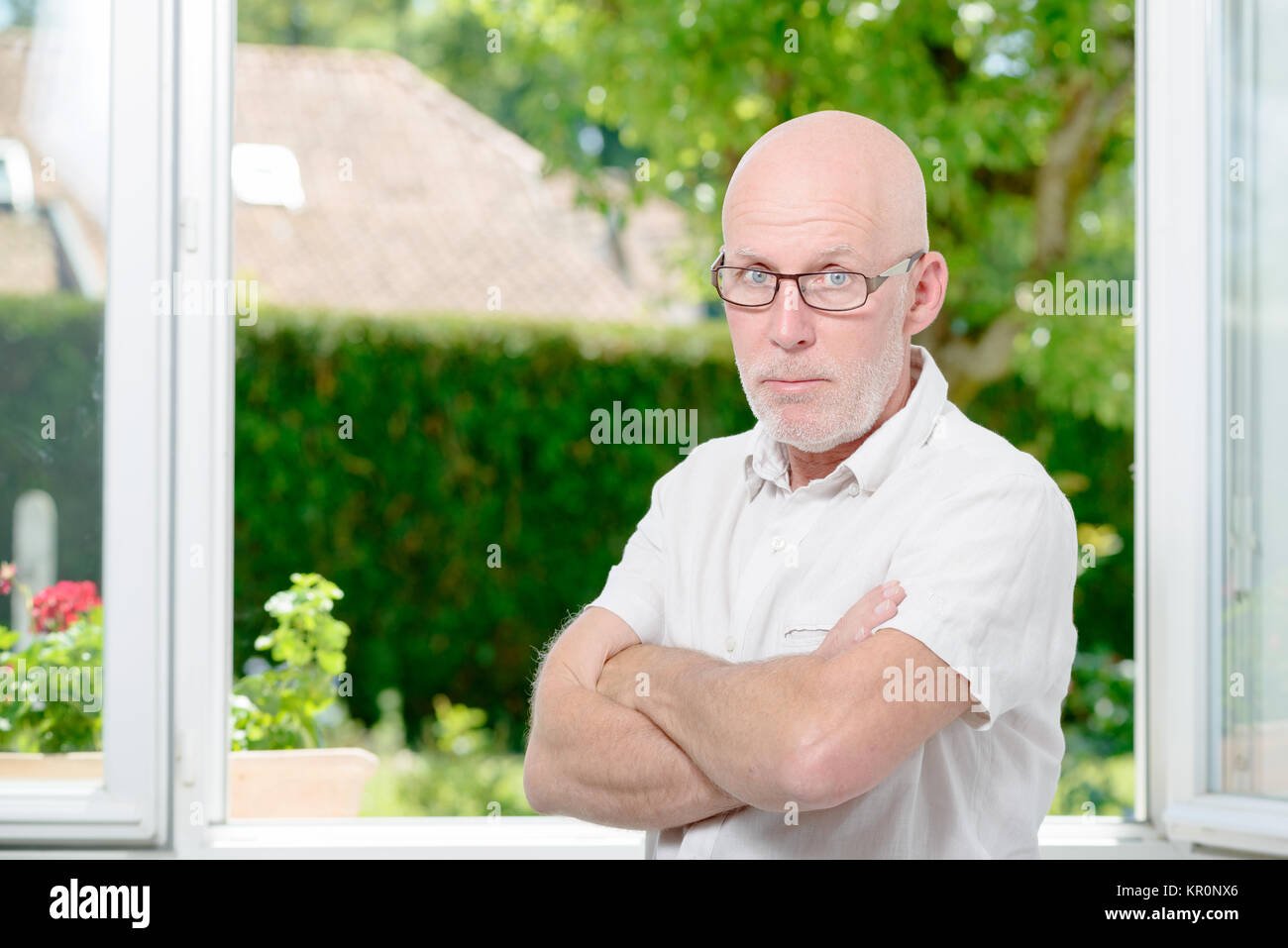 portrait of an angry man with arms crossed Stock Photo - Alamy