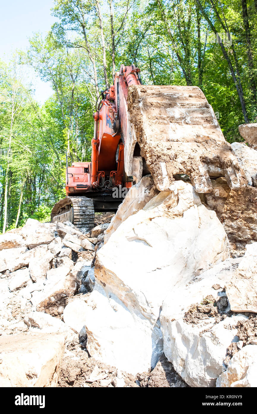 excavator with big shovel to work with rocks Stock Photo - Alamy